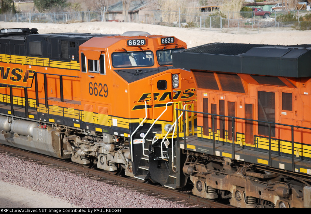 BNSF 6629 heads eastbound as the # 4 unit as they slow down for a crew swap.